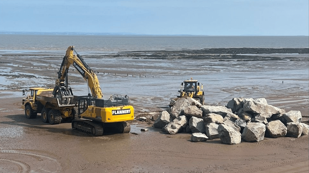 Warning to people not to climb on rock armour boulders on Blue Anchor ...