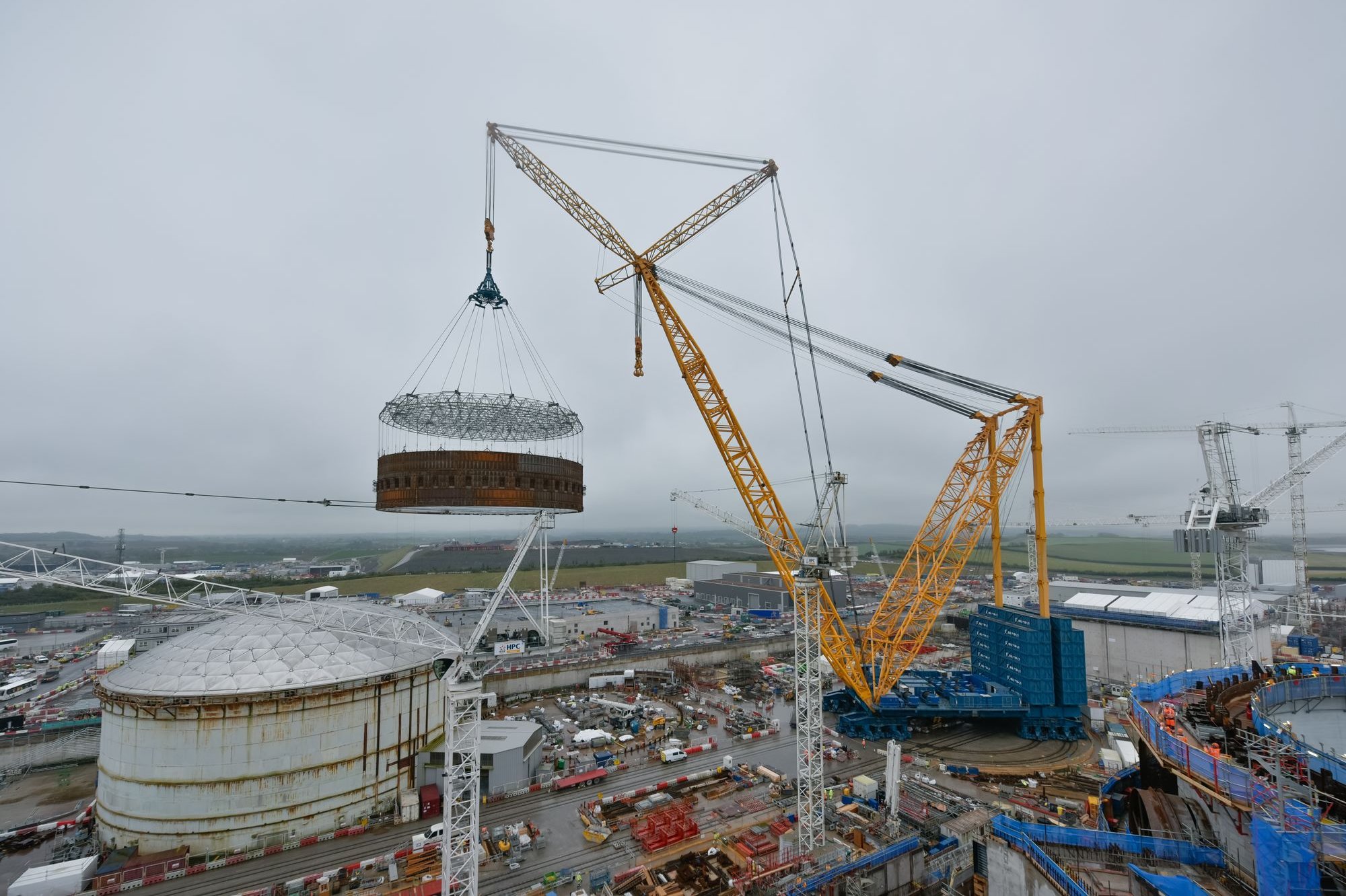 World's largest crane lifts reactor building steel liner into place for ...