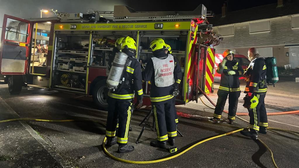 Fire crews from eight stations rush to fire in flat above village shop ...